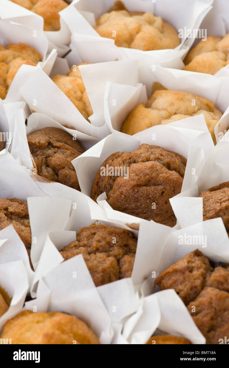 lots of freshly baked small muffins cakes in rows Stock Photo - Alamy