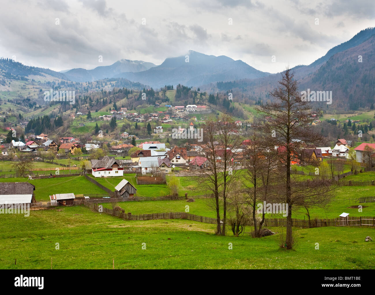 Beautiful landscape with village houses and mountains Stock Photo - Alamy