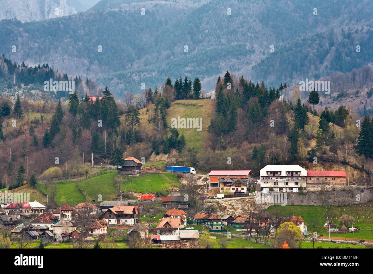 Beautiful landscape with village houses and mountains Stock Photo - Alamy