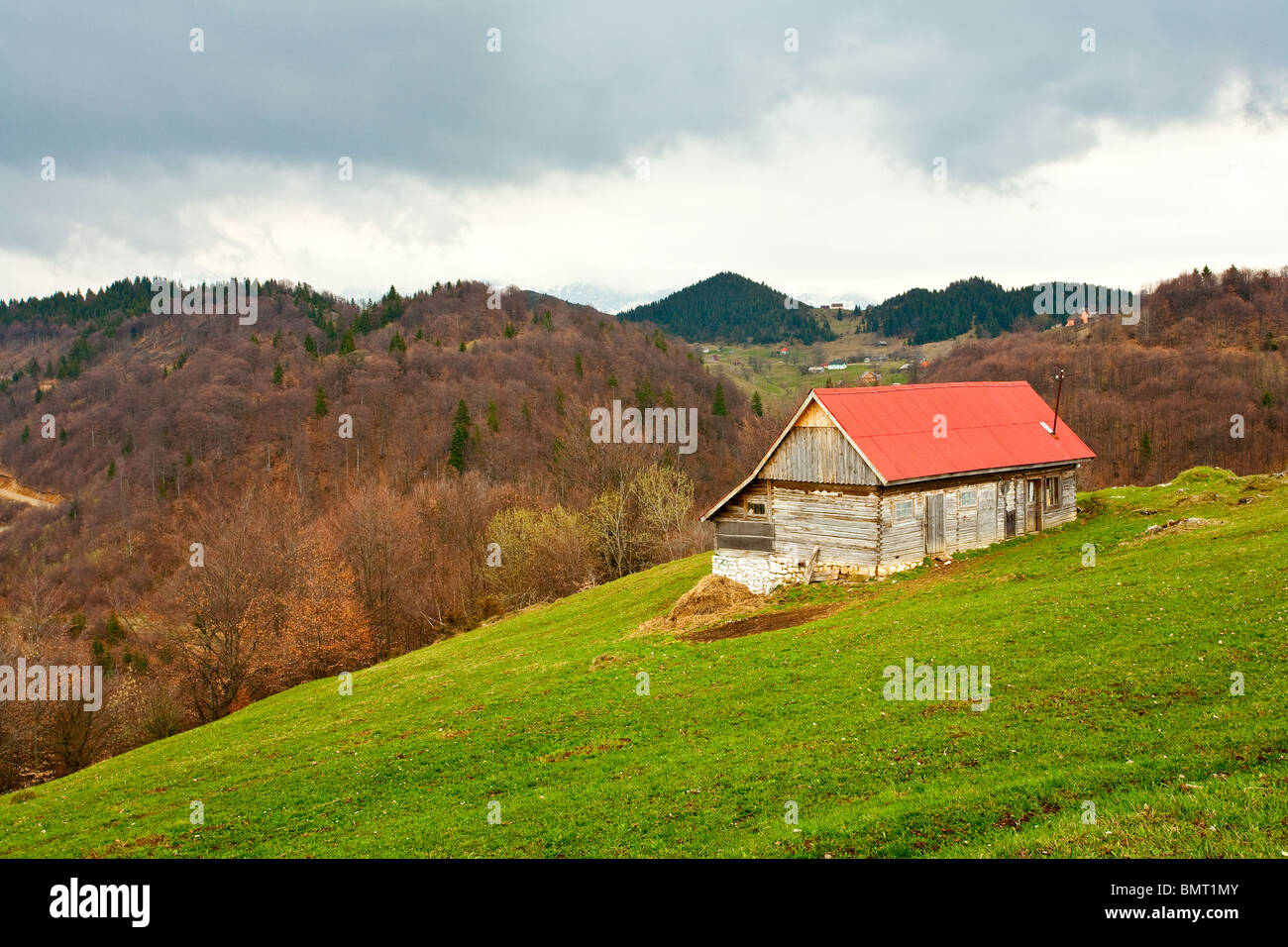 Single house on a meadow in mountains Stock Photo - Alamy