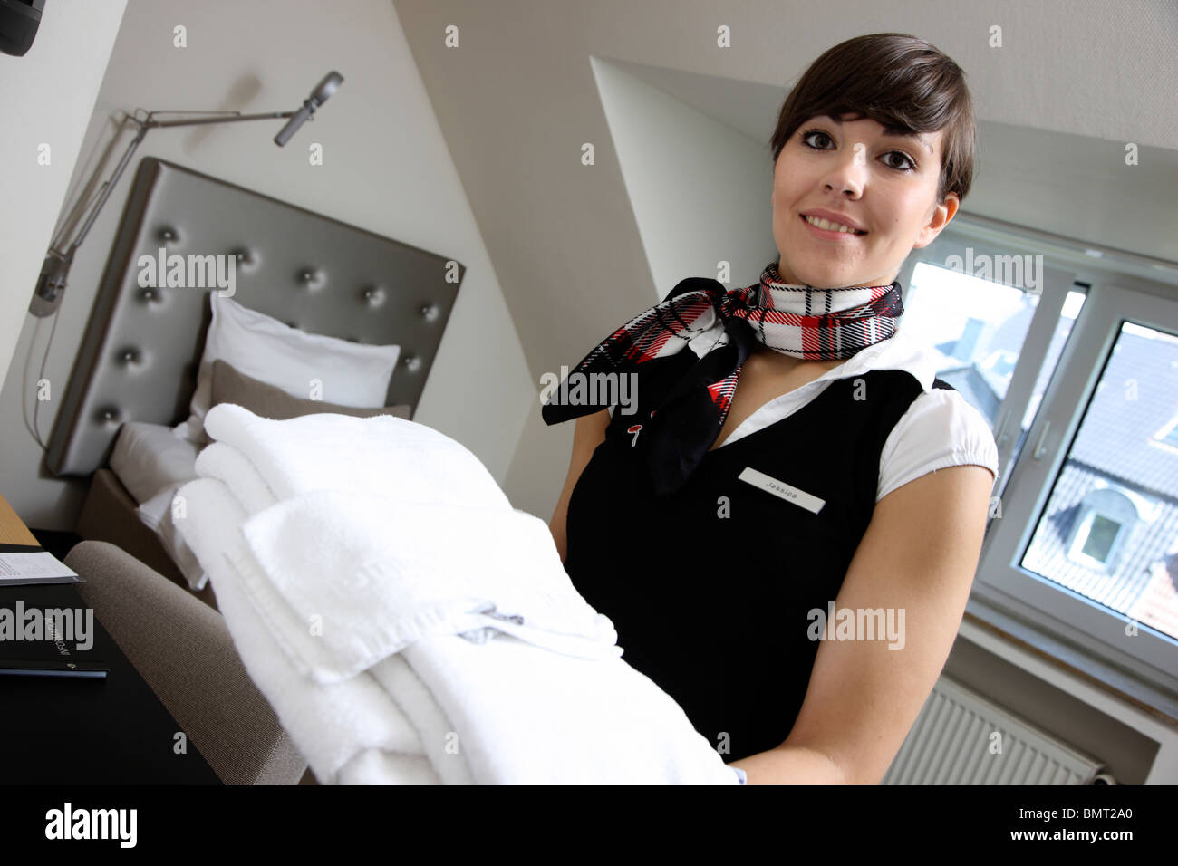 Hotel, room service, house keeping at work in a hotel room. Cleaning up ...