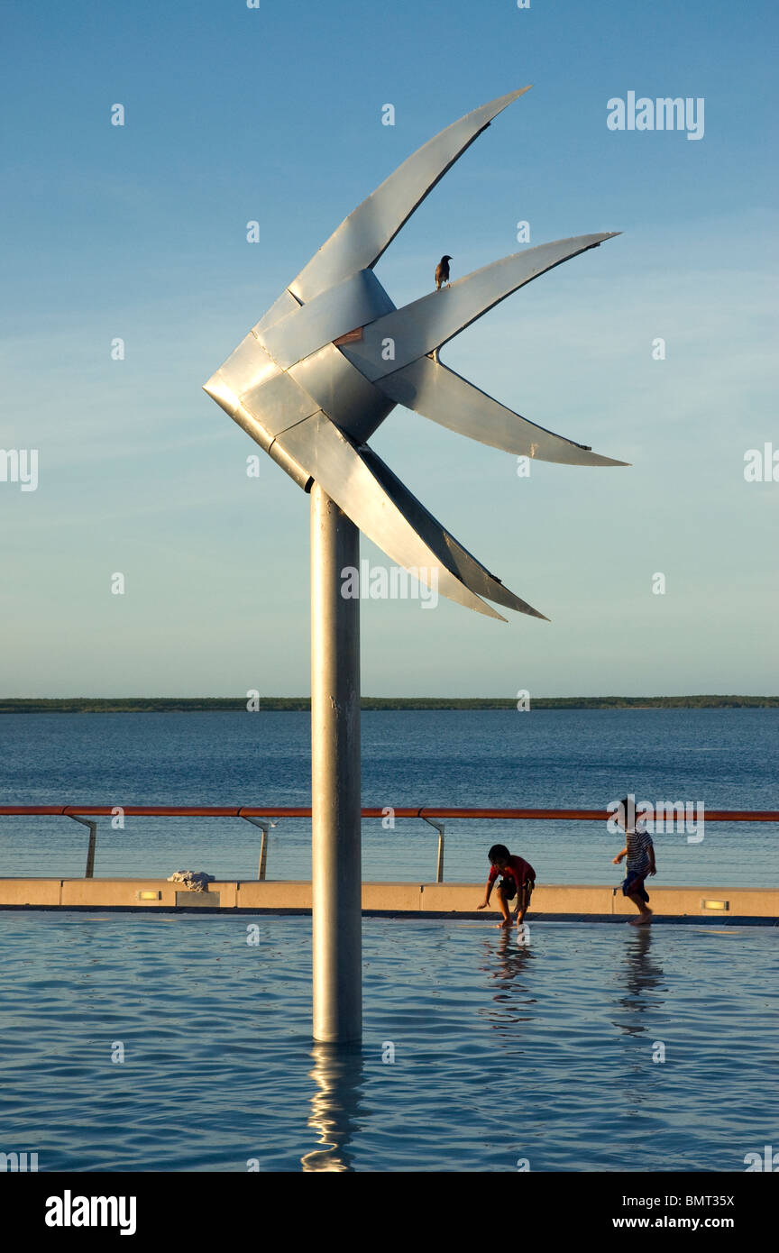 Silver fish sculpture in a swimming pool on Cairns promenade Australia ...