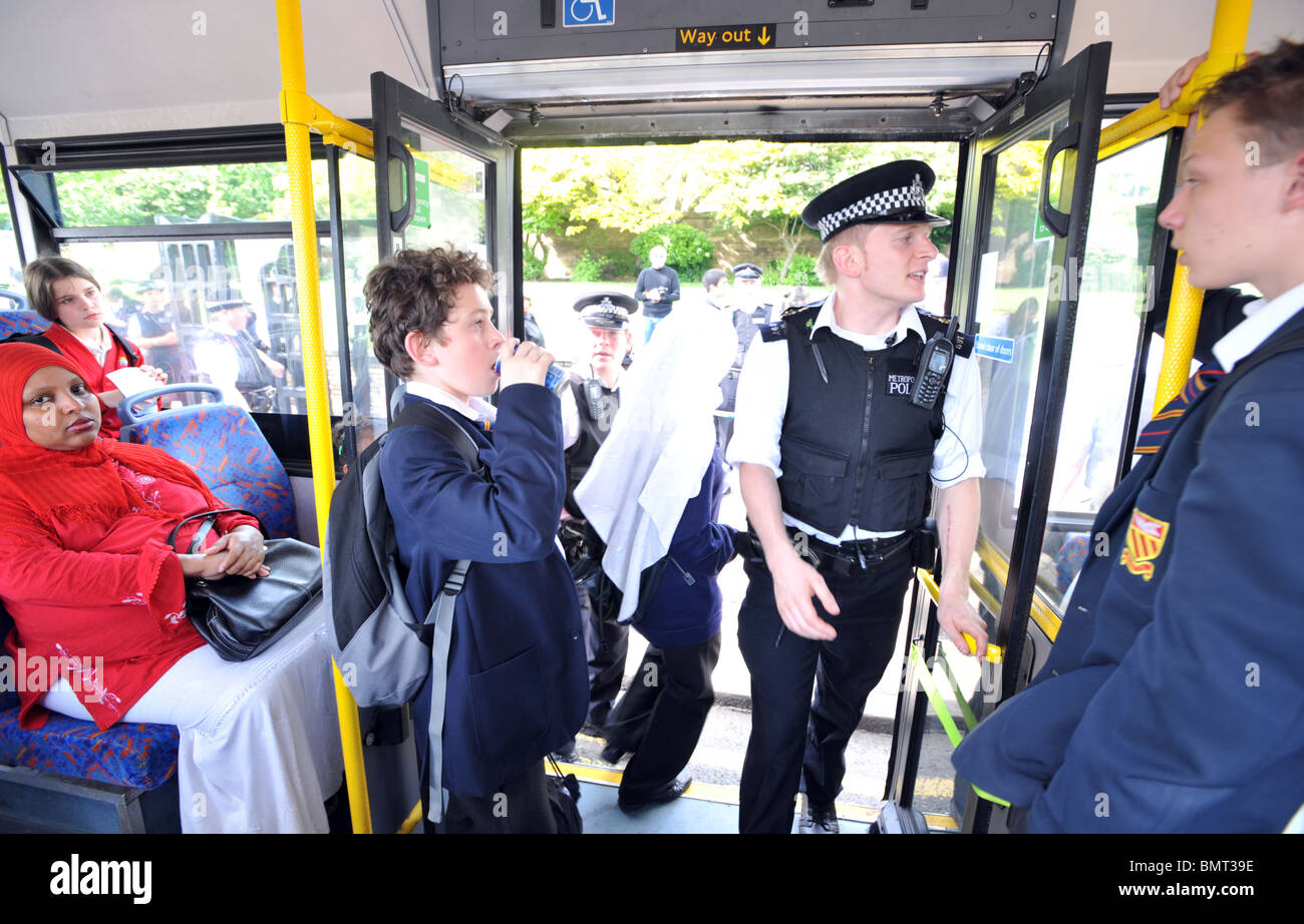 police perform stop and search on a bus route in north west london ...