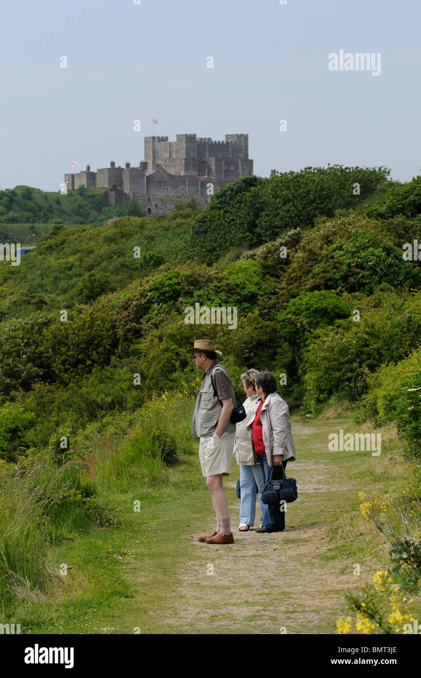Tourists walking on a coastal path close to Dover Castle Kent England ...