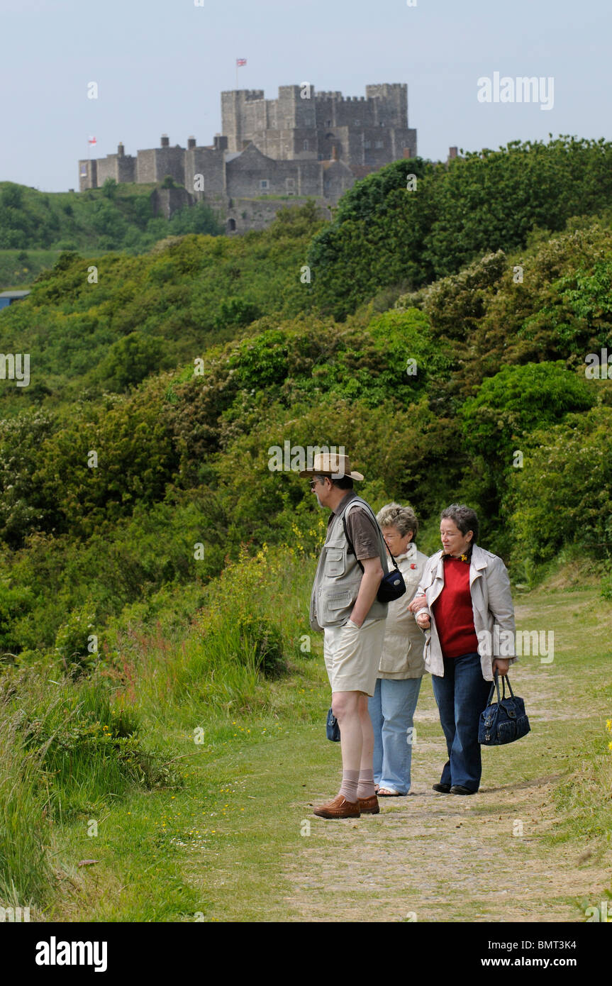 Tourists walking on a coastal path close to Dover Castle Kent England ...