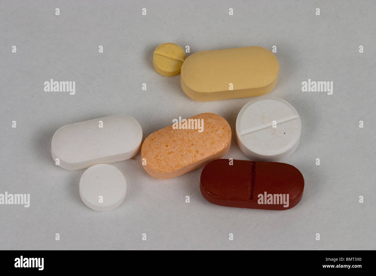 Tablets on white background Stock Photo - Alamy