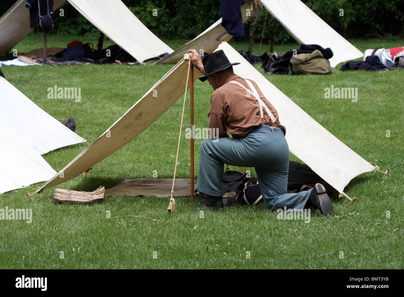 A civil war soldier bending down at his tent Stock Photo - Alamy