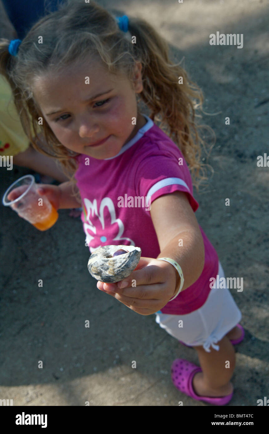 small girl holding a hermit crab Stock Photo - Alamy