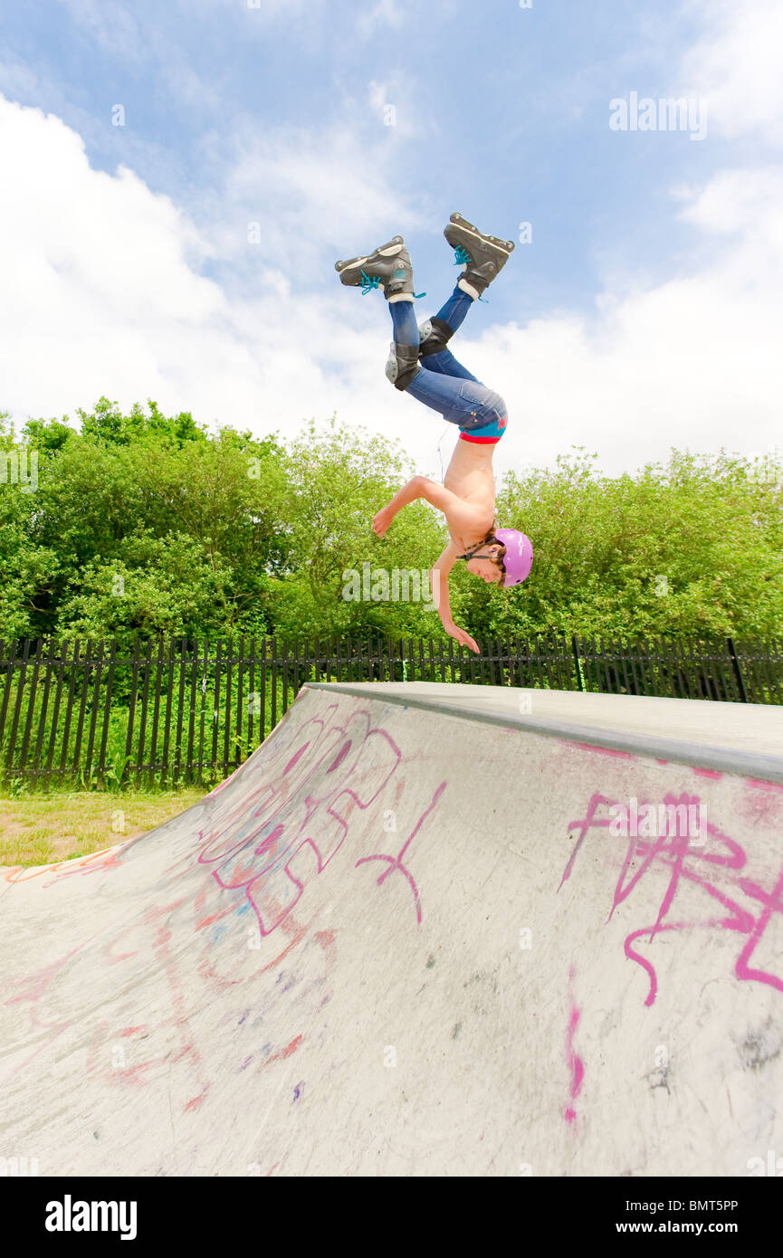 In-line skater (rollerblader) in action at purpose built skate park in ...