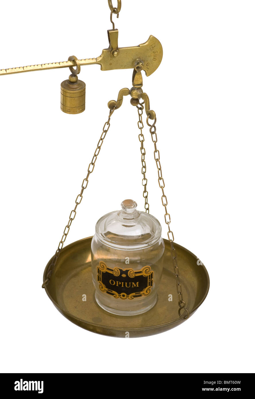 Weighing the marijuana. Top view of opium jar on a brass pan of a scale ...