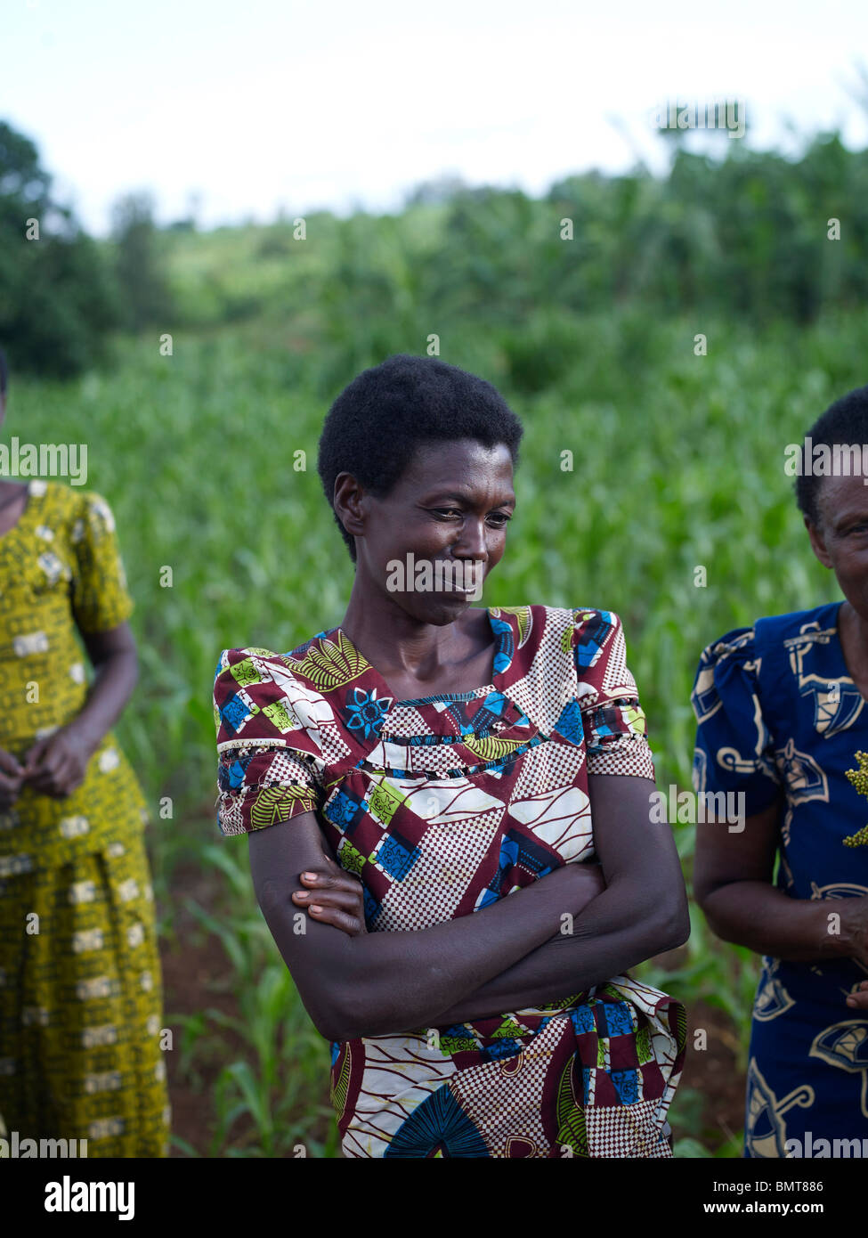 Smiling African lady in a field in Rwanda, post genocide Stock Photo ...
