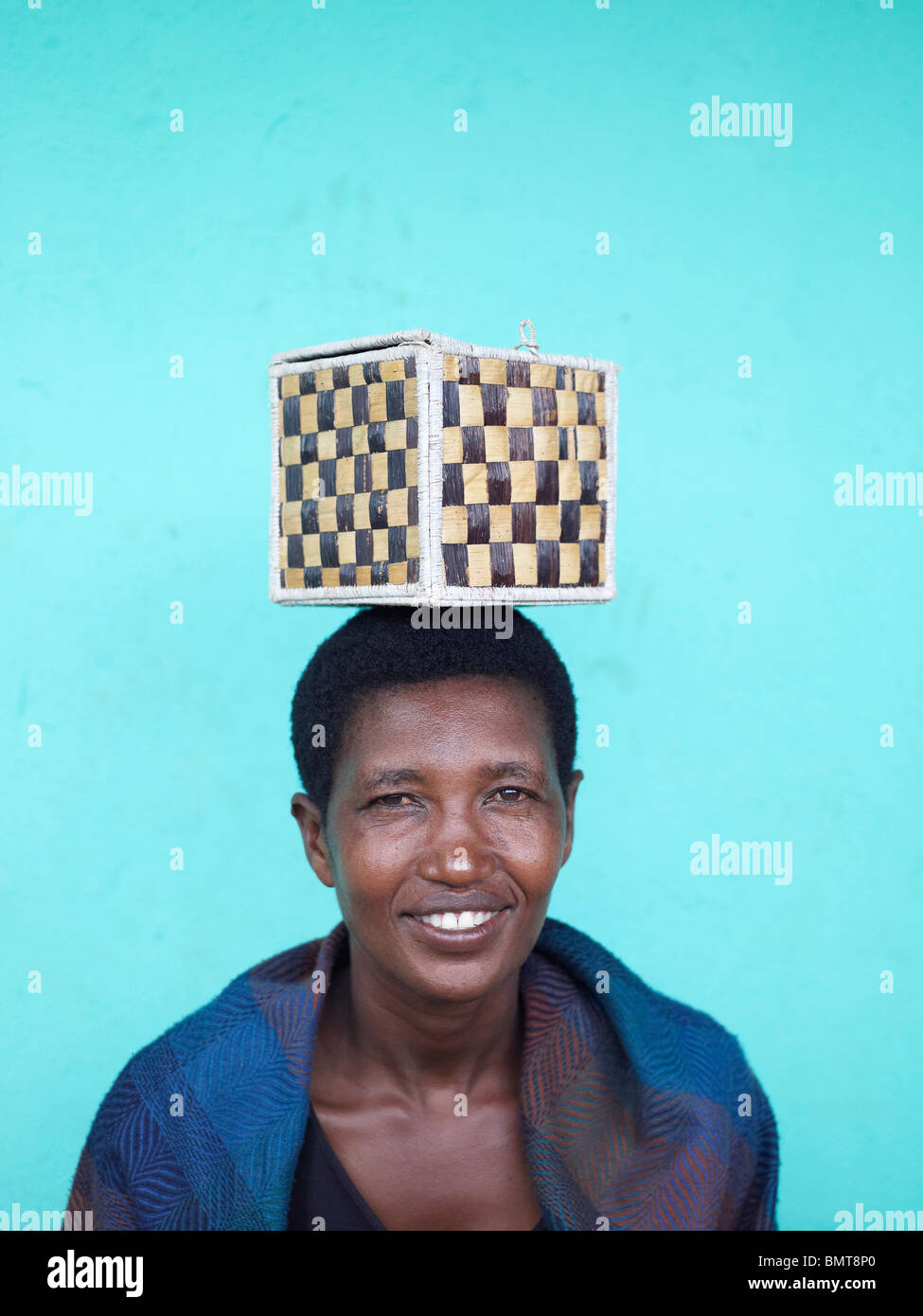 African lady balancing a cube on her head in Rwanda, post genocide ...