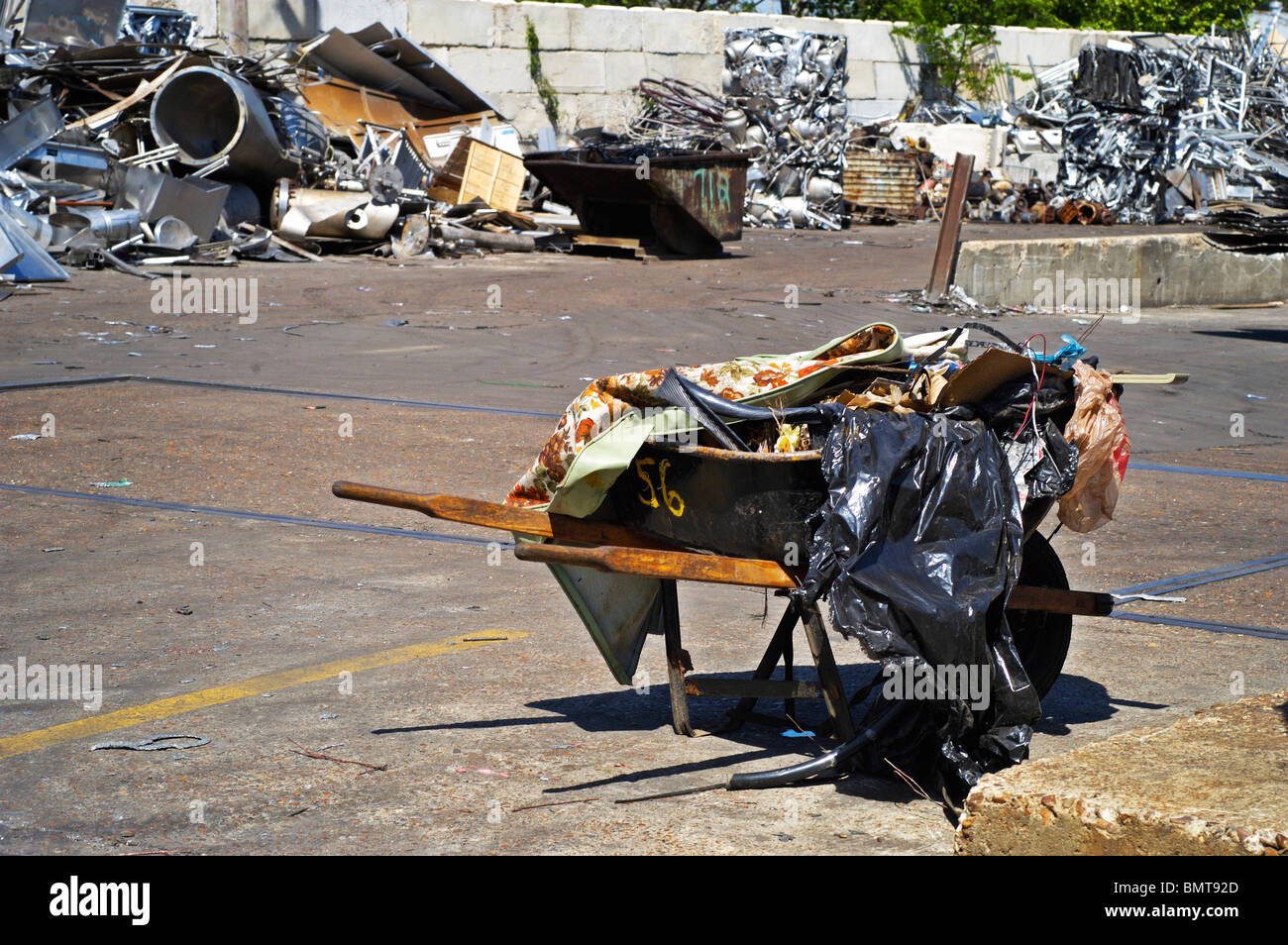 Wheelbarrow loaded and ready with scrap in the yard Stock Photo - Alamy