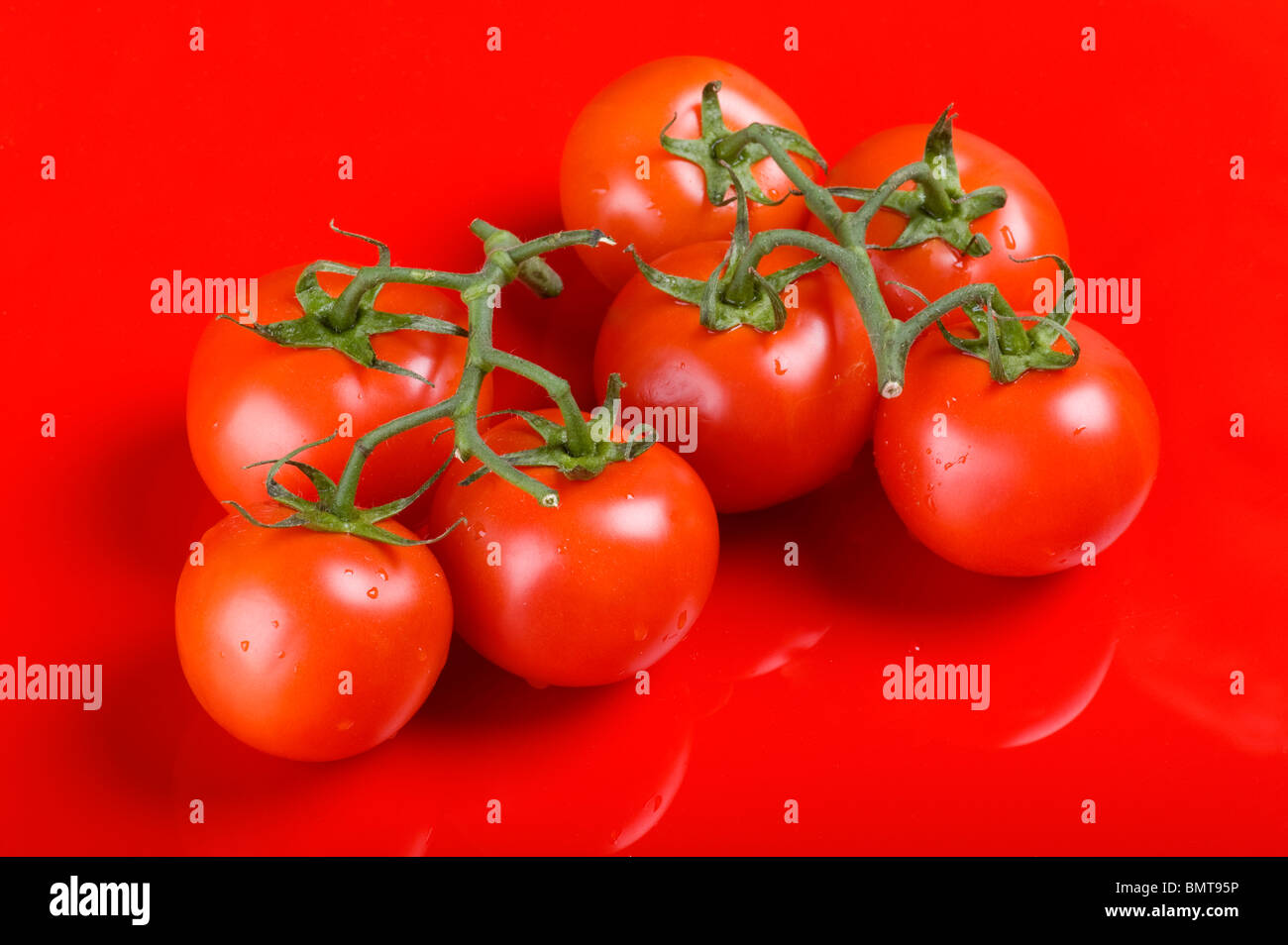 object on red - food tomato close up Stock Photo - Alamy