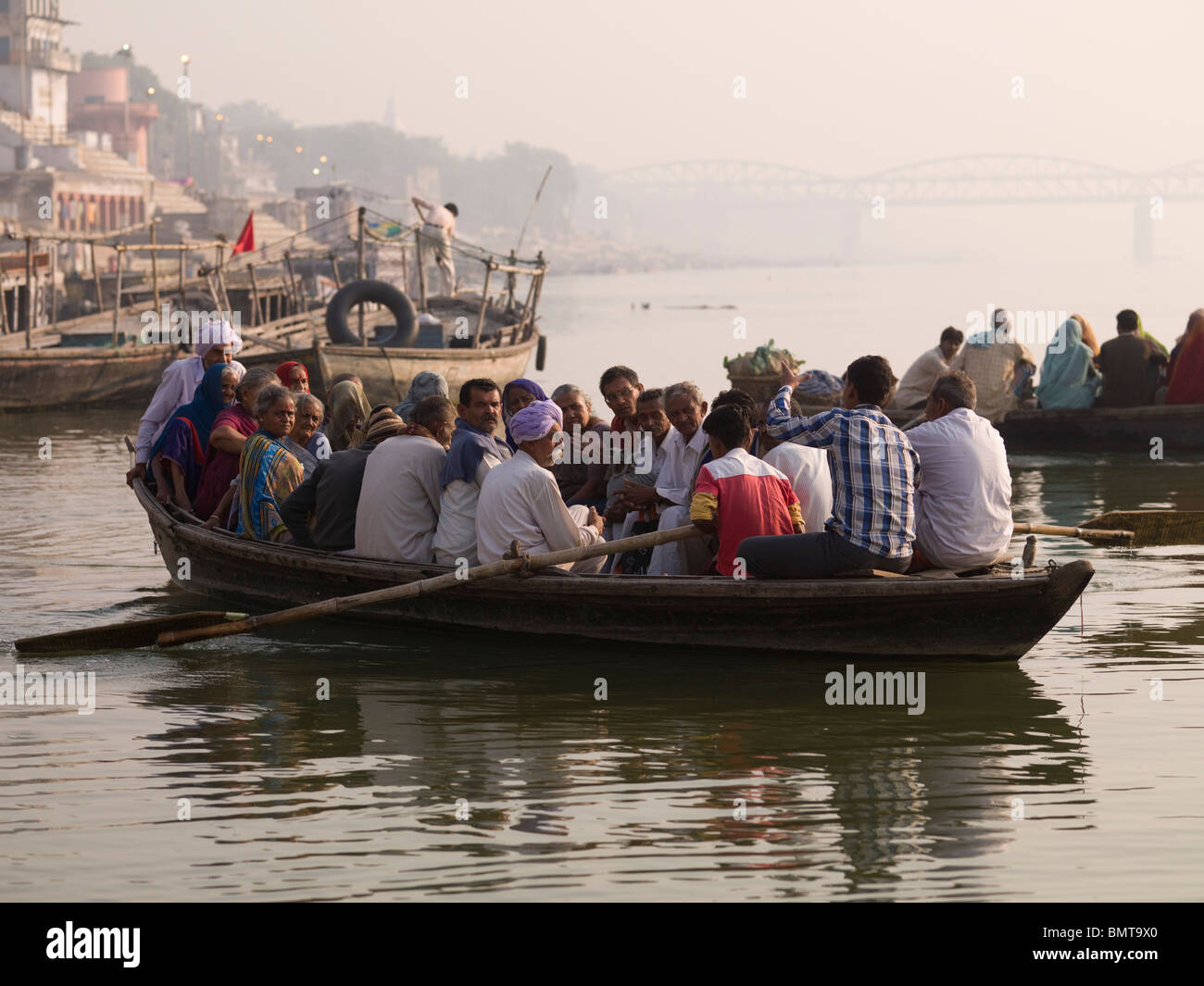 Varanasi,India;People On A Boat For Transport Down The Ganges River ...