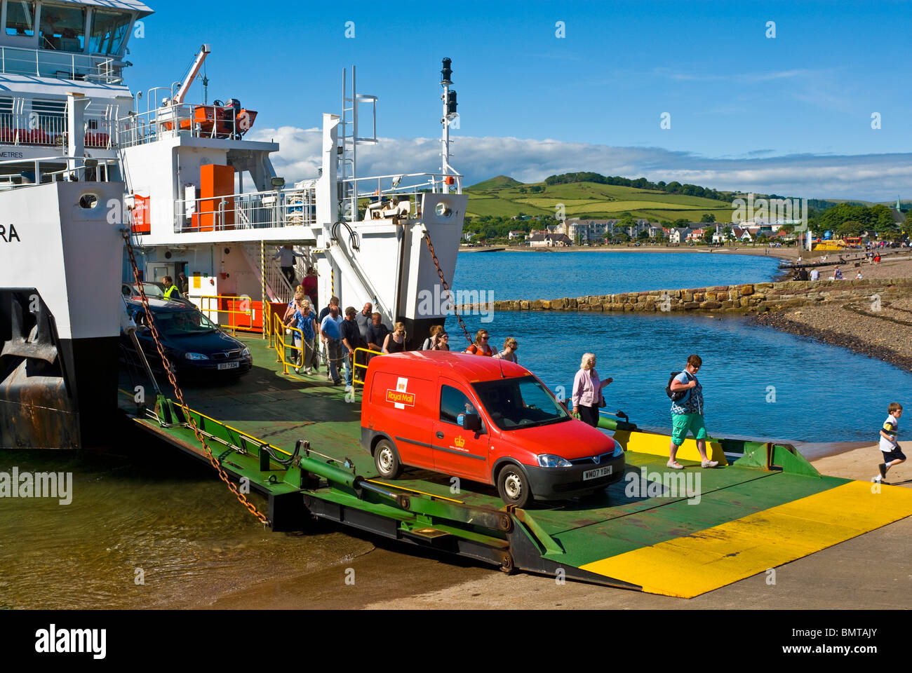 Passengers and cars disembarking from the Cumbrae ferry at Largs ...
