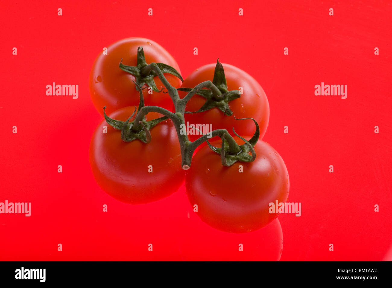 object on red - food tomato close up Stock Photo - Alamy