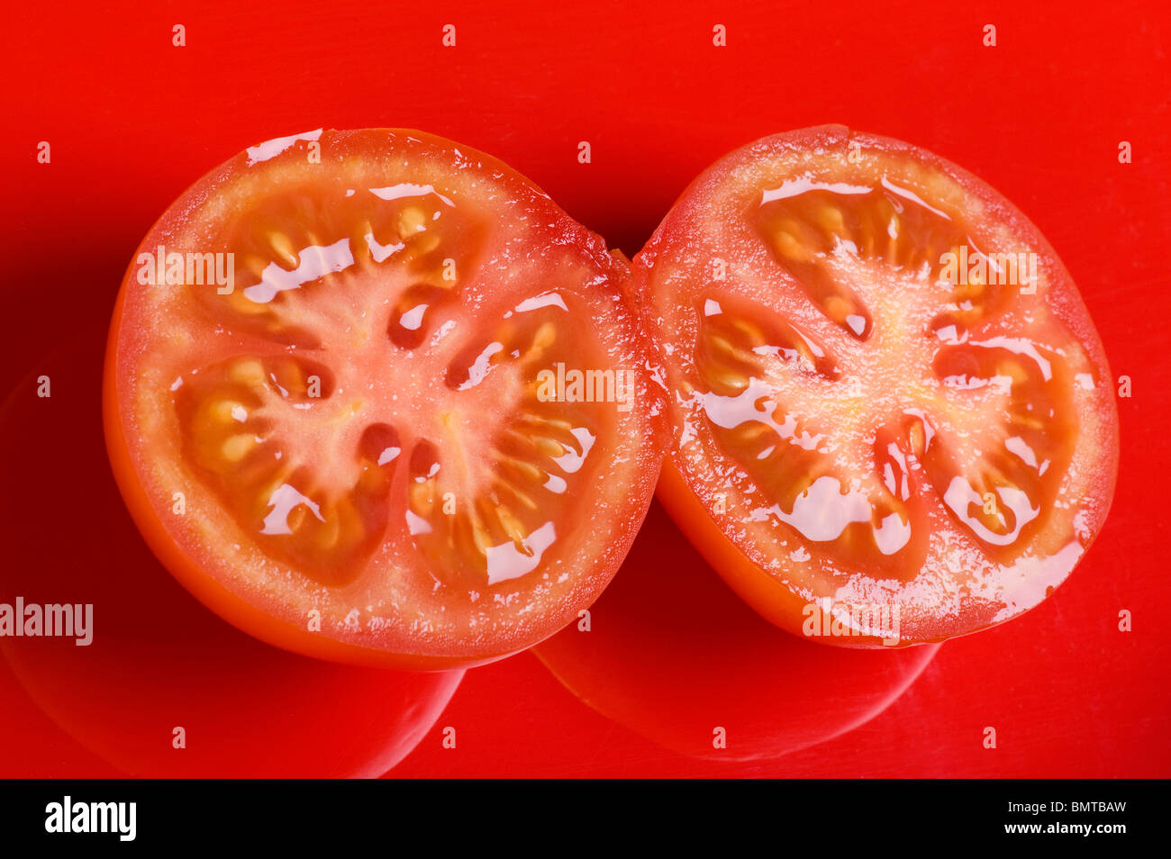 object on red - food tomato close up Stock Photo - Alamy