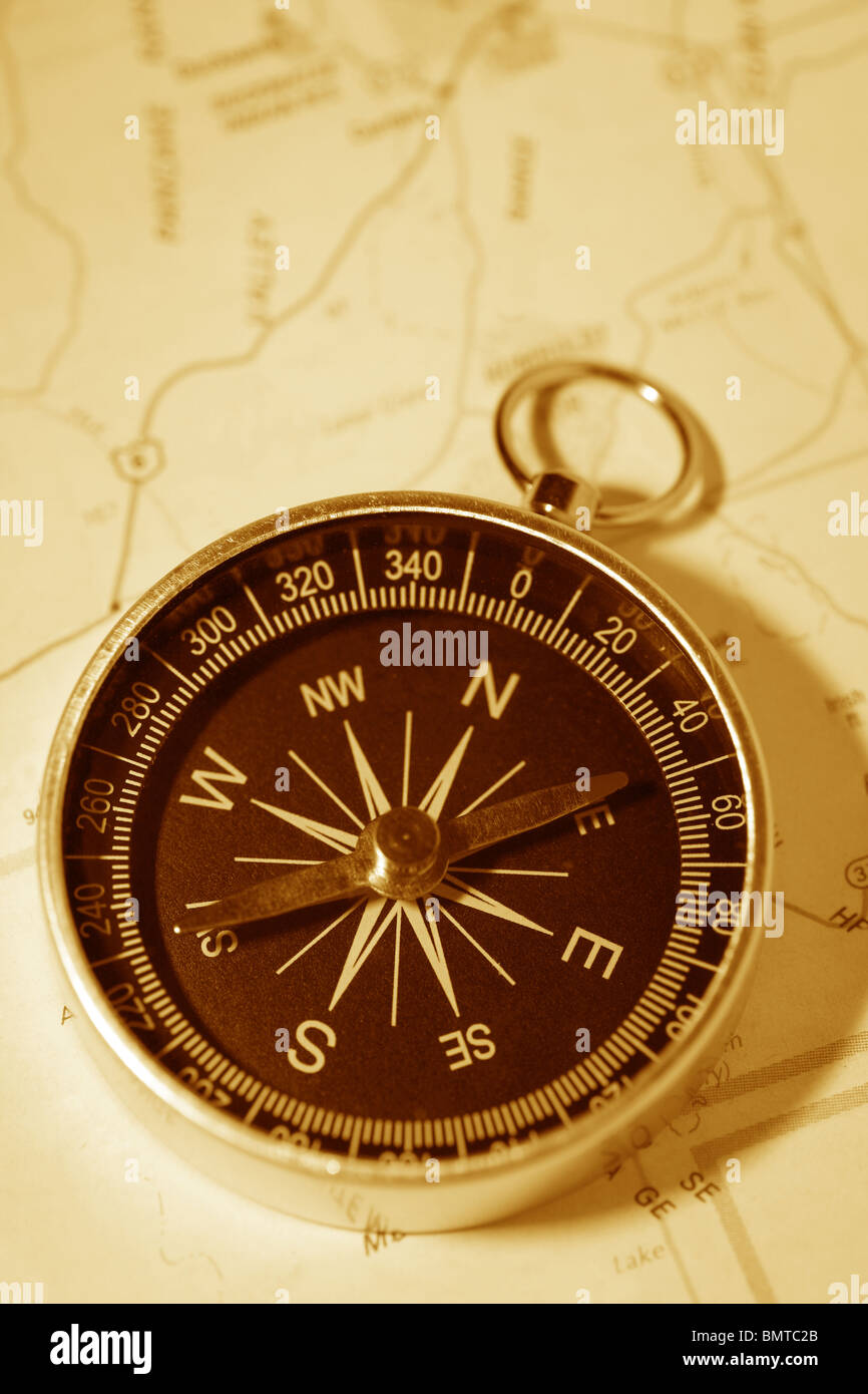 Compass and map close up shot Stock Photo - Alamy