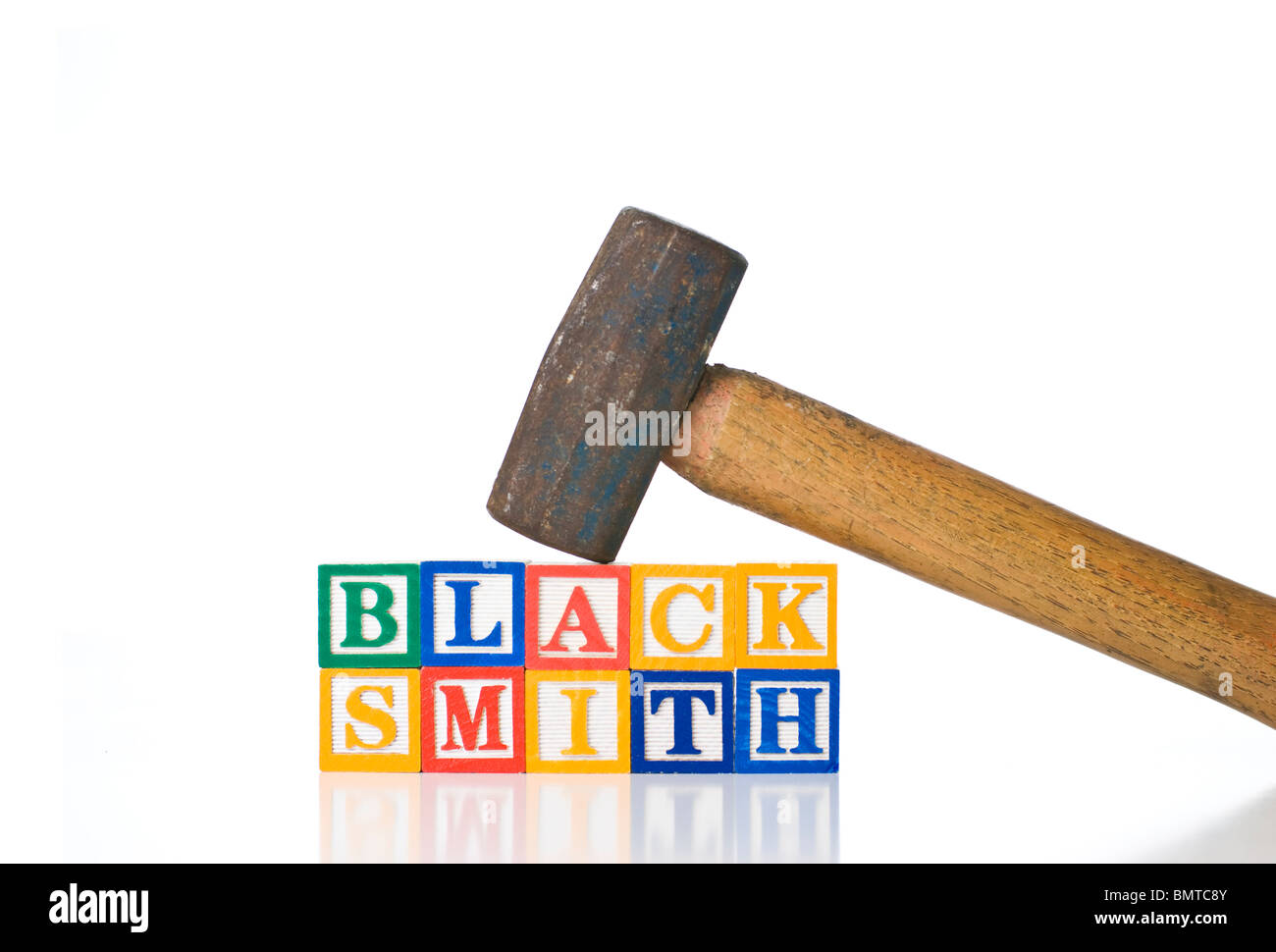 Colorful children's blocks spelling BLACK SMITH with a small sledge ...