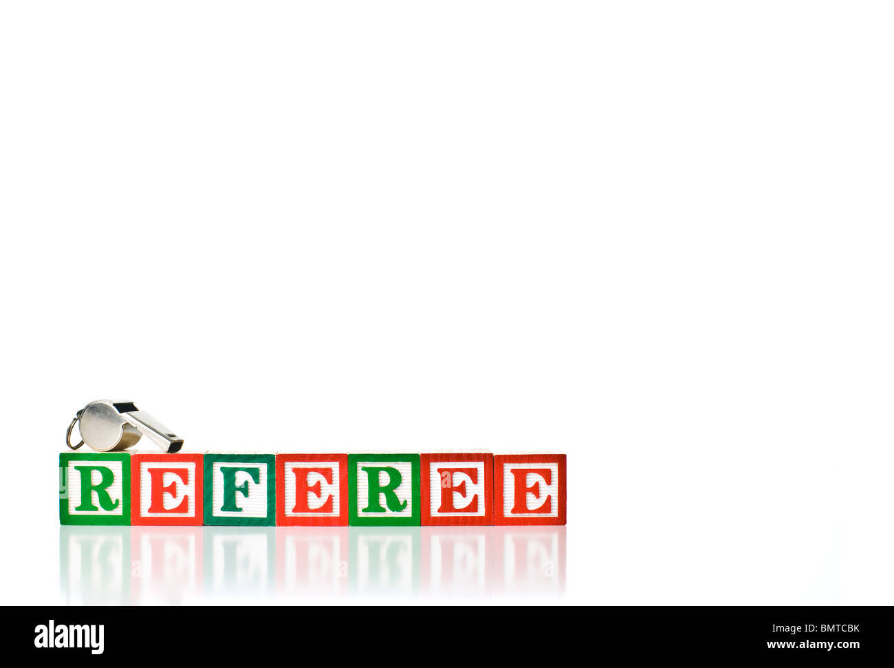 Colorful children's blocks spelling REFEREE with a metal whistle Stock ...