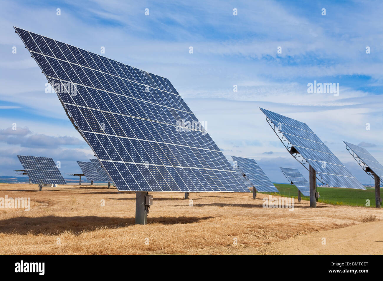 A field of photovoltaic solar panels providing alternative green energy ...