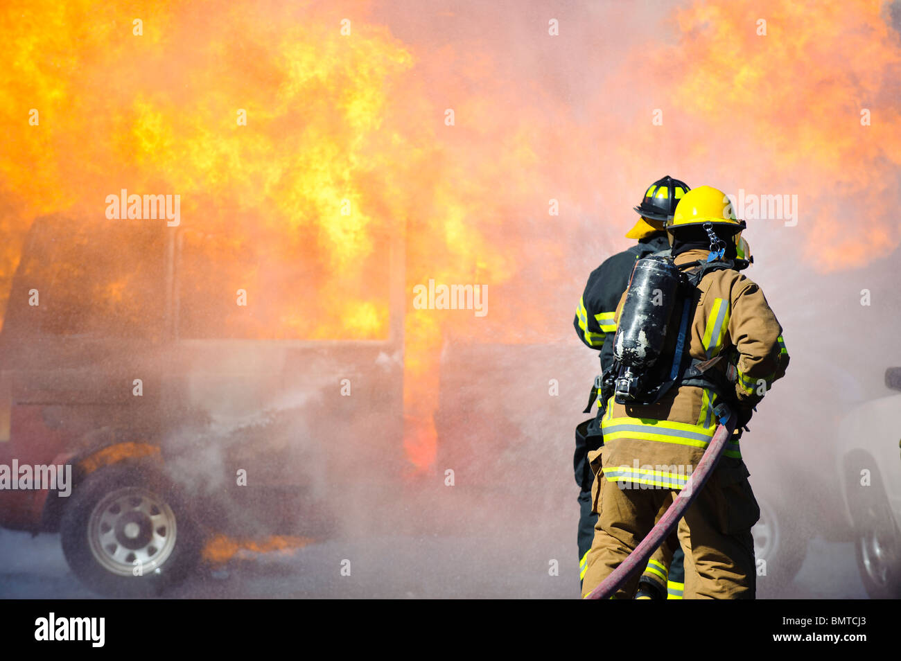 Firefighters prepare to attack a propane fire during a training ...