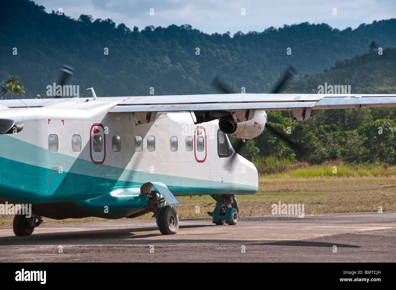 Small propeller plane ready for take-off in a field runaway Stock Photo ...