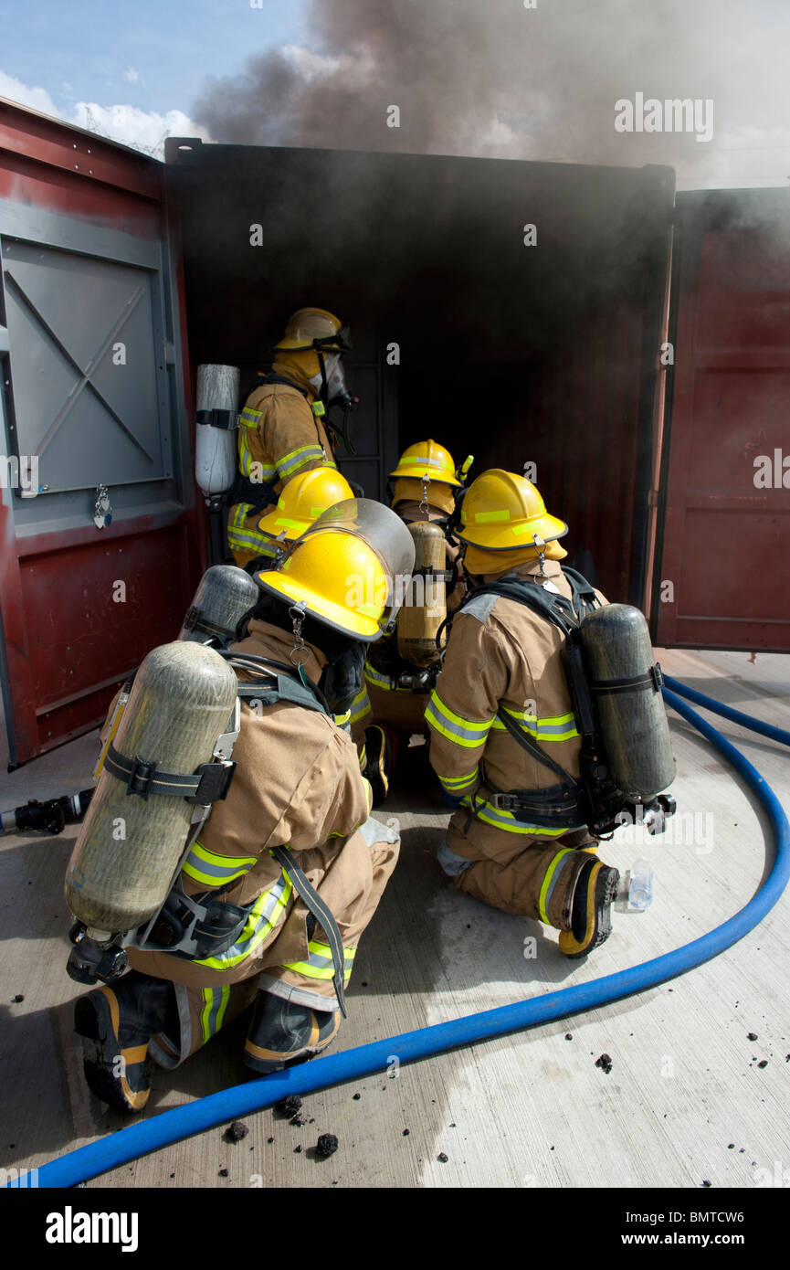 Firefighters line up for their turn during a training exercise Stock ...