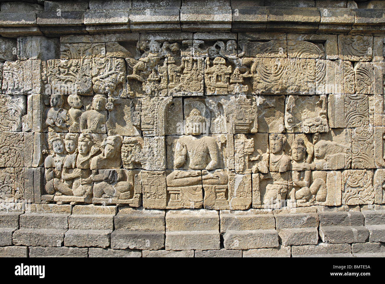 Indonesia-Java-Borobudur, Buddha seated in Padmasana with disciples on ...