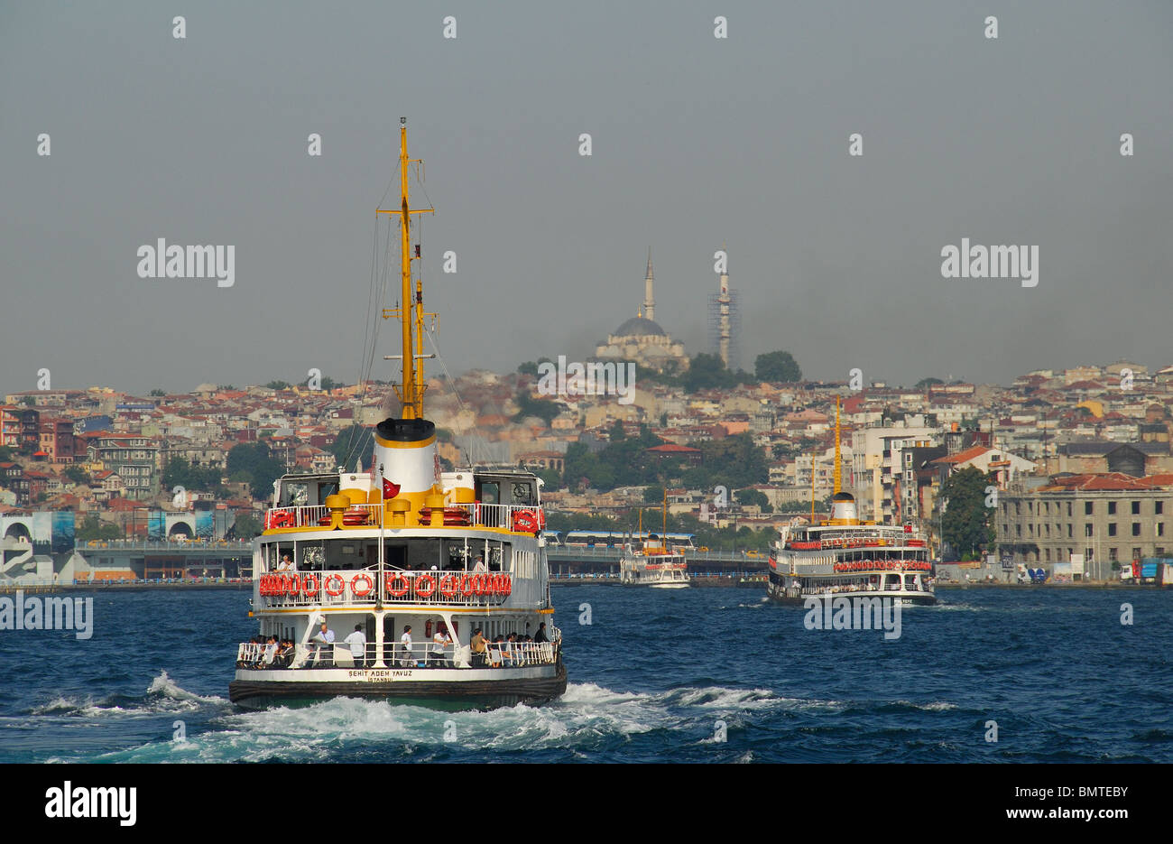 ISTANBUL, TURKEY. Bosphorus ferries entering the Golden Horn on their ...