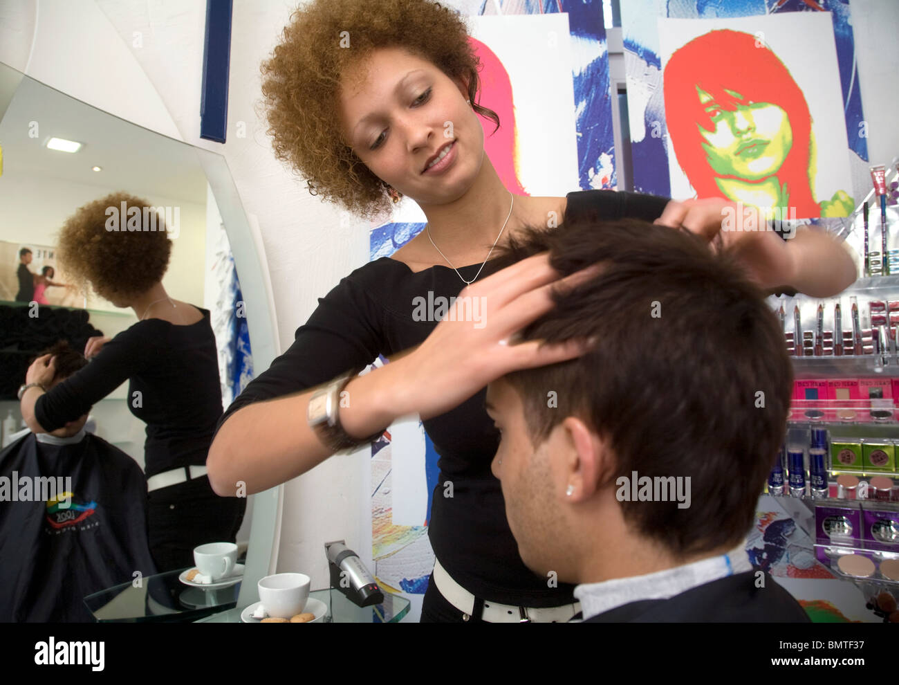 A trainee hairdresser in the Morante salon, Essen, Germany Stock Photo ...
