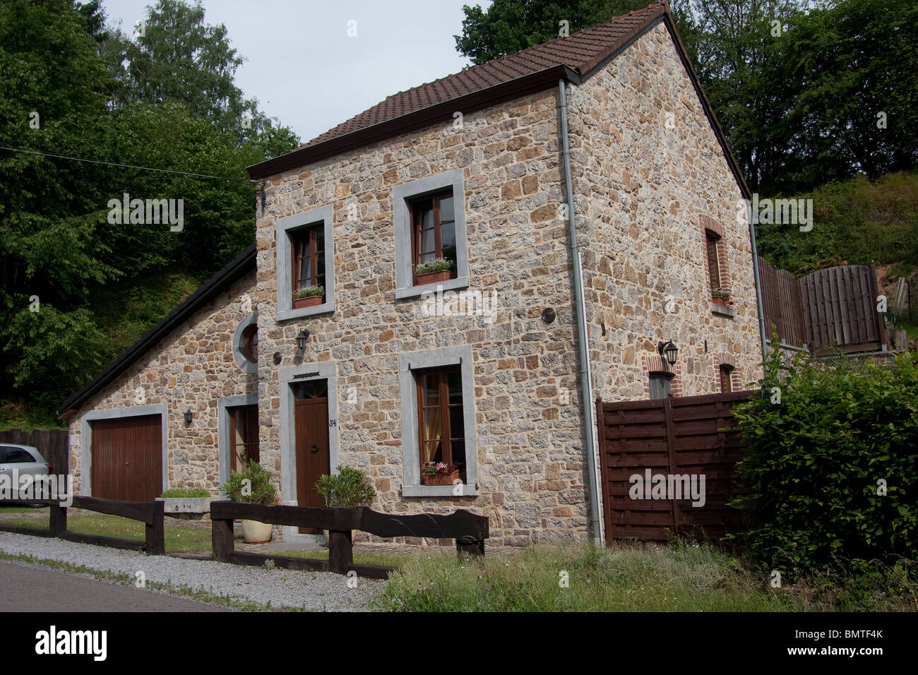 hillside village house road forest cottage new Stock Photo - Alamy