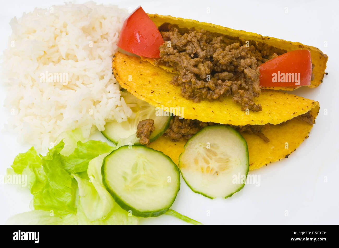 Stuffed Taco Shells Minced Beef Rice And Salad Stock Photo - Alamy