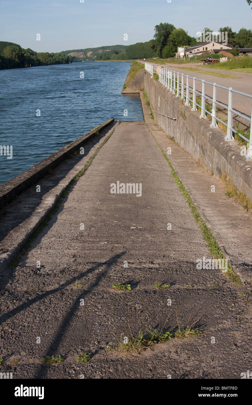concrete small boat slipway river fence path trees Stock Photo - Alamy