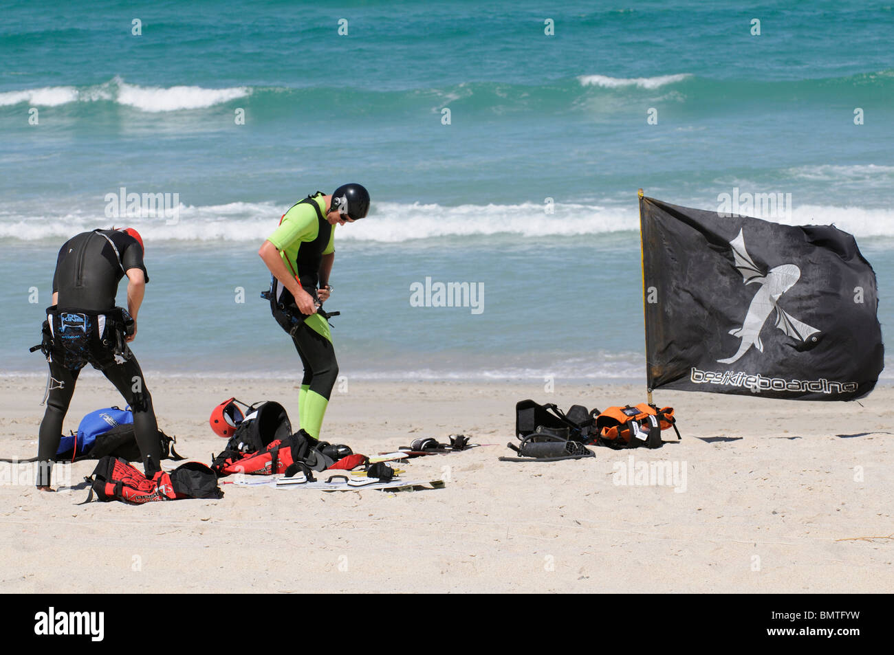 Kiteboarders prepare to ride their kites from Sunrise Beach Cape Town ...