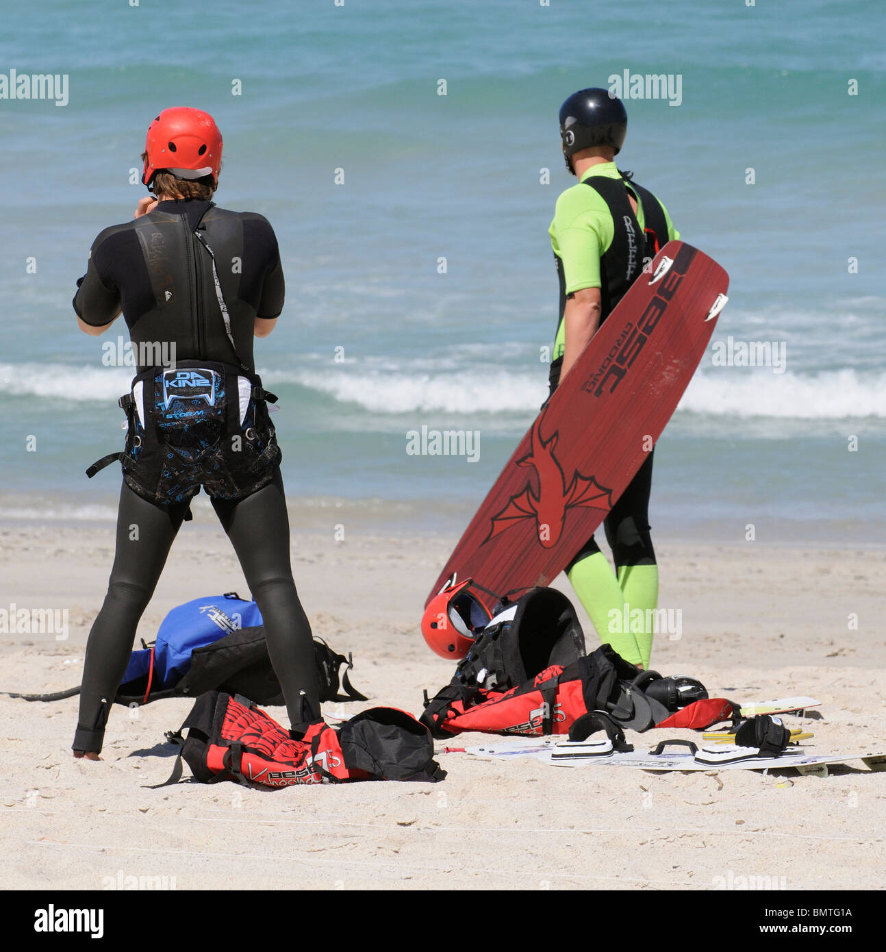 Kiteboarders prepare to ride their kites from Sunrise Beach Cape Town ...