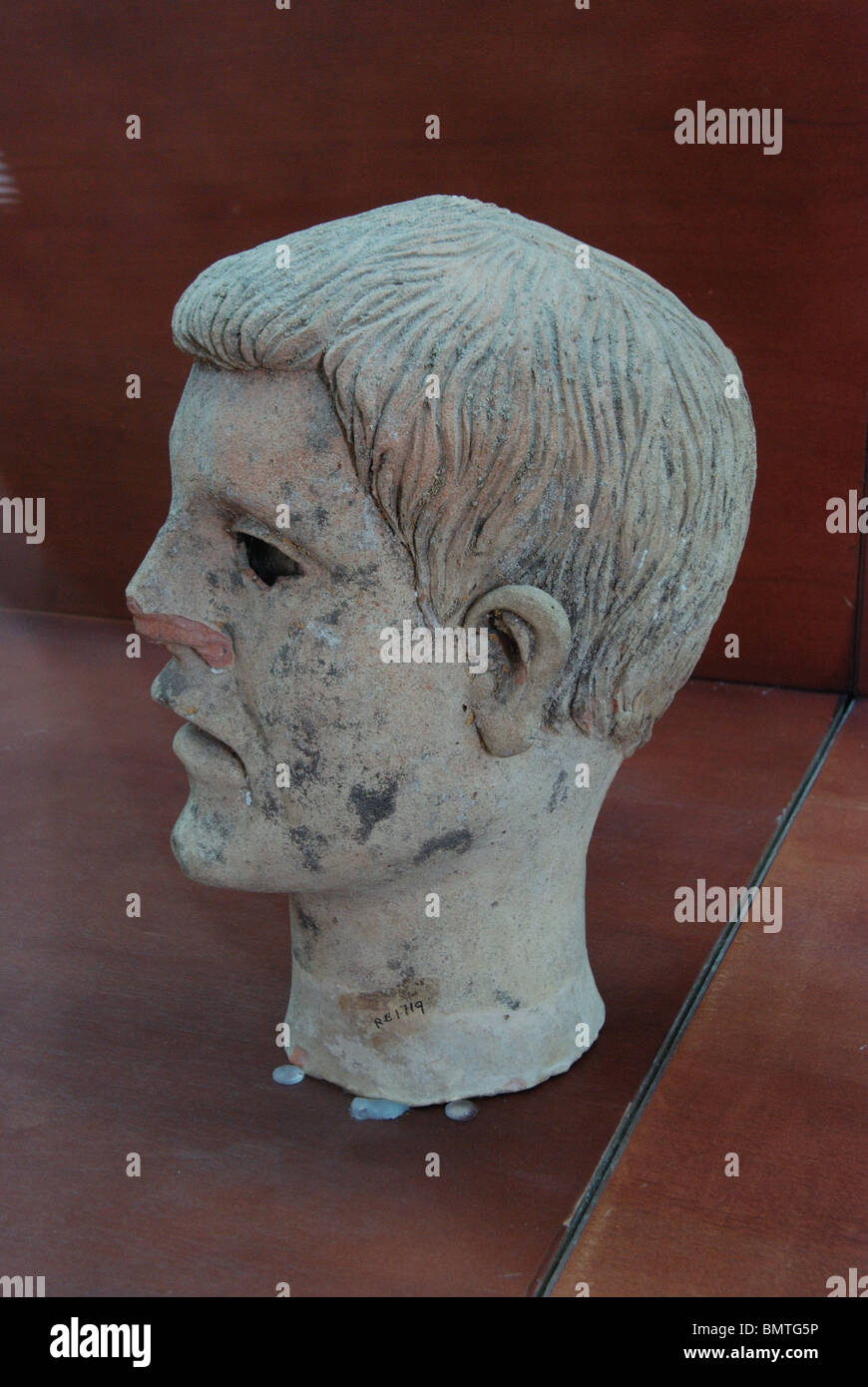 Head statue in the museum, archaeological complex , Carmona, Seville ...