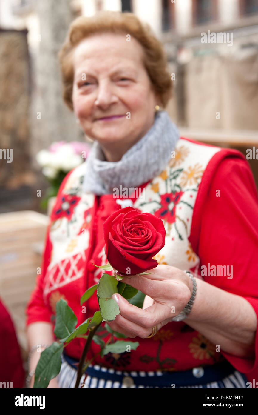 Local woman selling red roses in las Ramblas of Barcelona in the ...