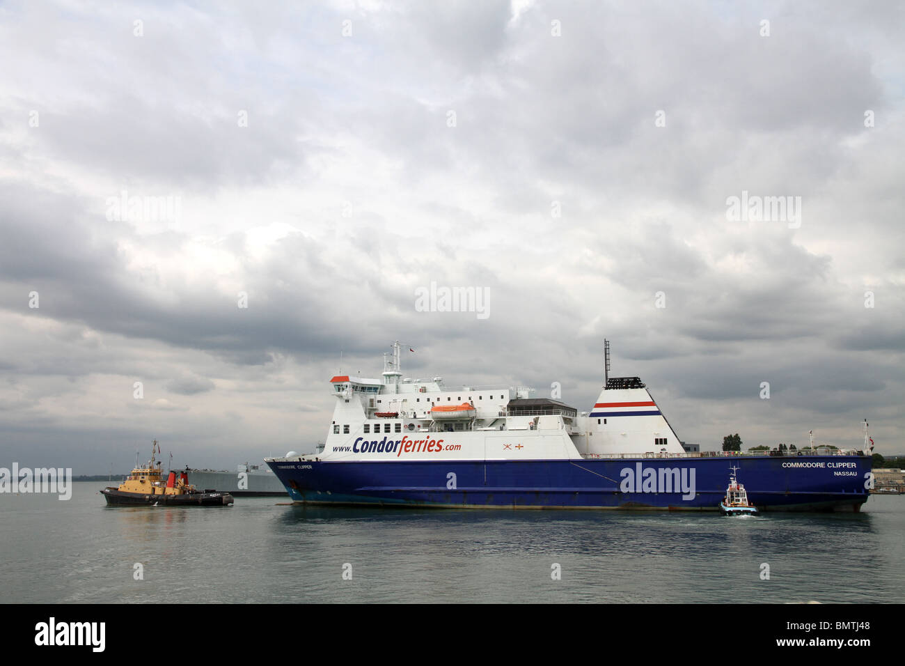 The Commodore Clipper ferry being towed out of Portsmouth harbour by ...