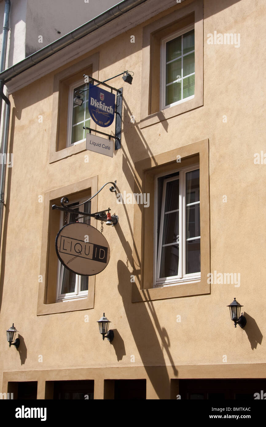peach wall windows bar beer signs wall lights Stock Photo - Alamy