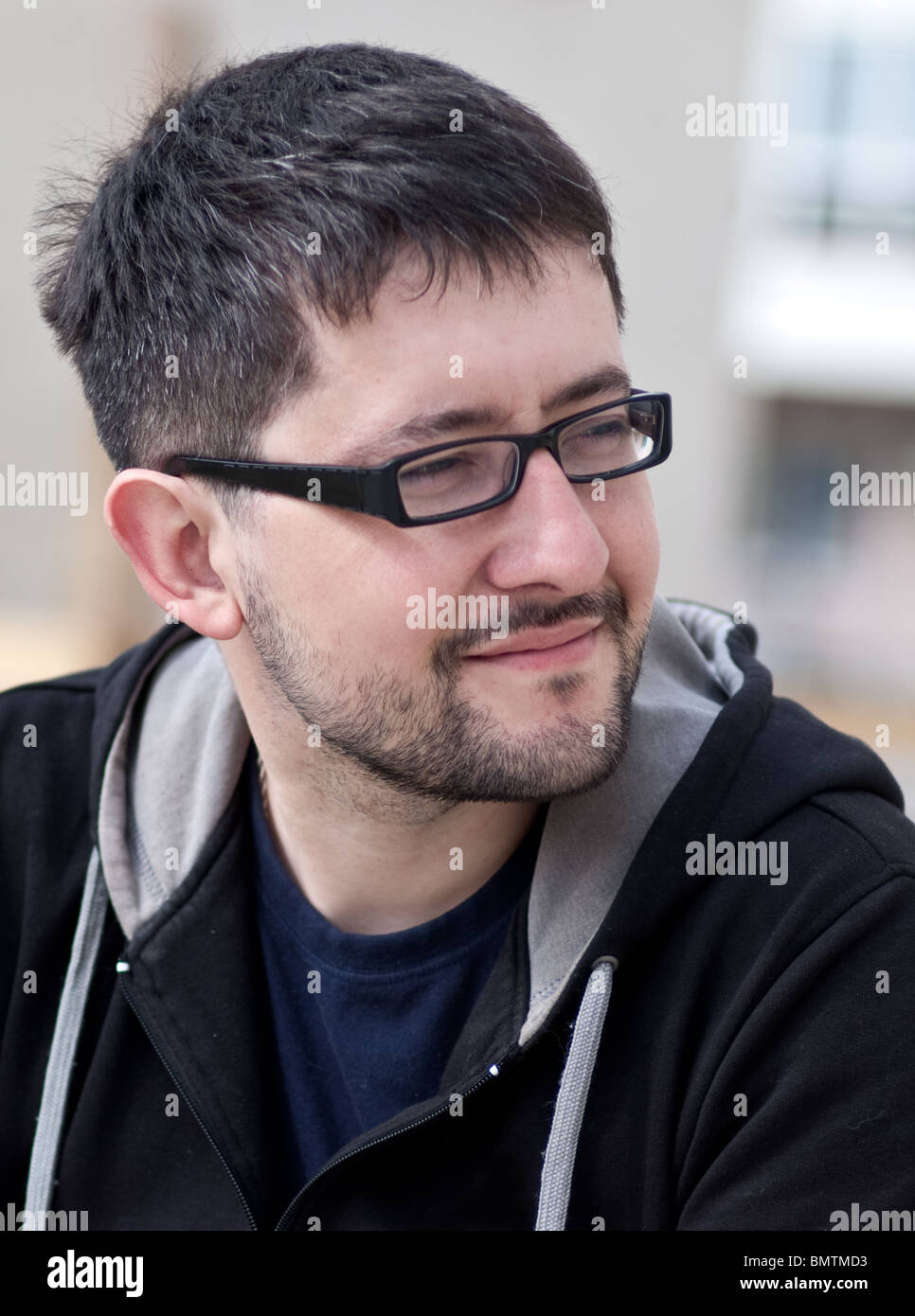 Portrait of a young male caucasian student with beard and glasses Stock ...