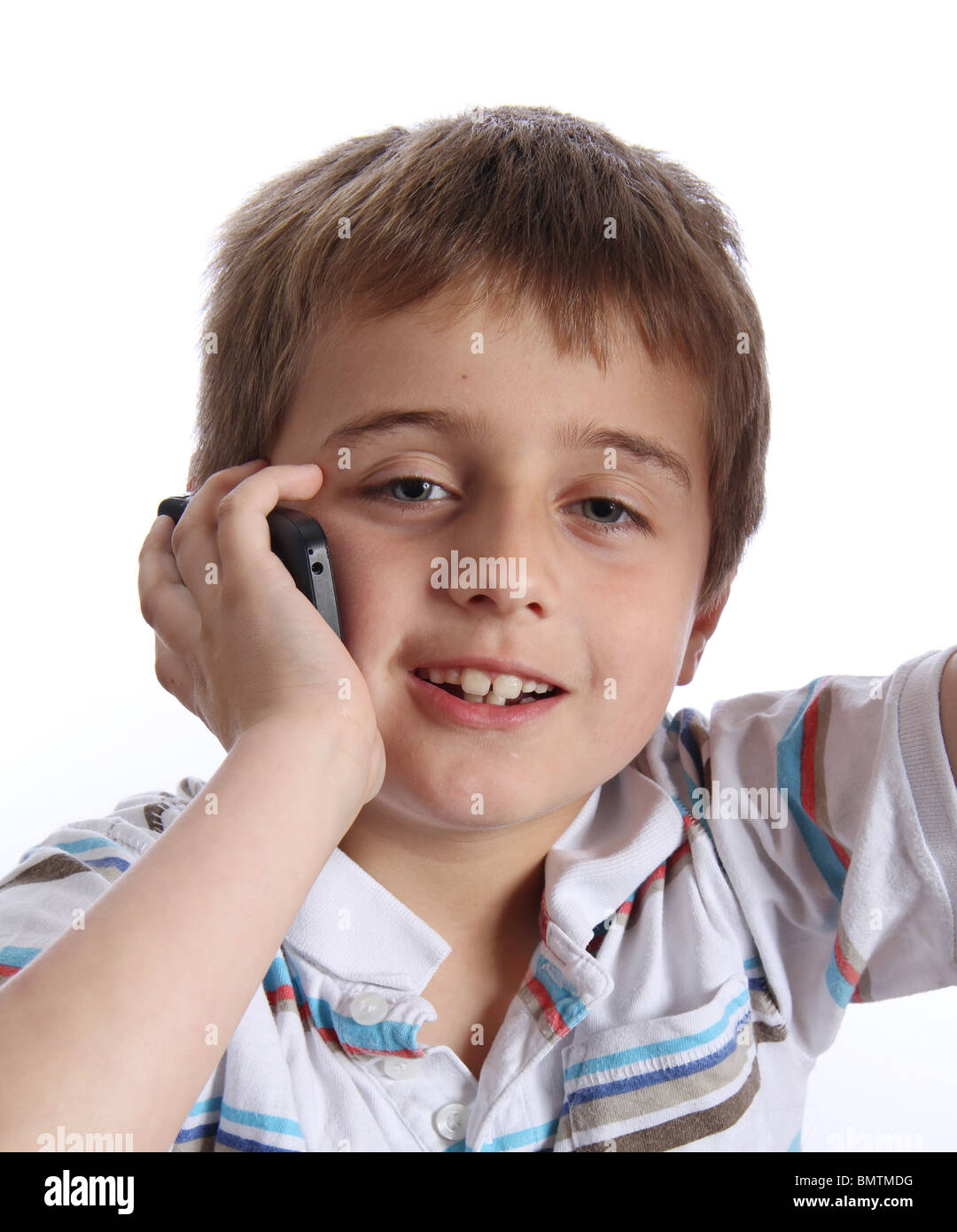 Small boy using a telephone talking to his friend Stock Photo - Alamy
