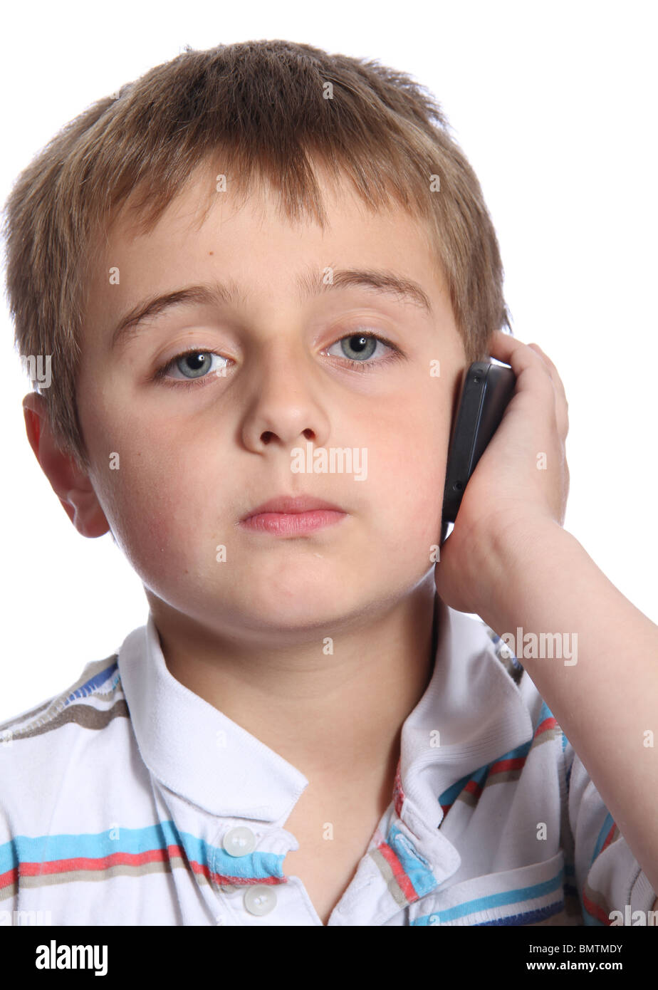 Small boy using a telephone talking to his friend Stock Photo - Alamy