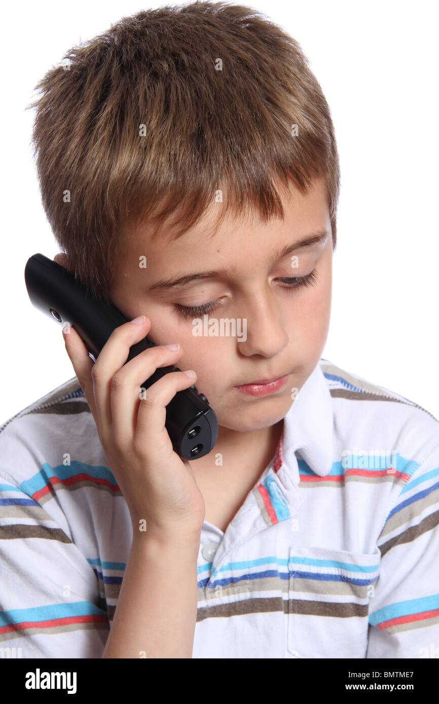 Small boy using a telephone talking to his friend Stock Photo - Alamy