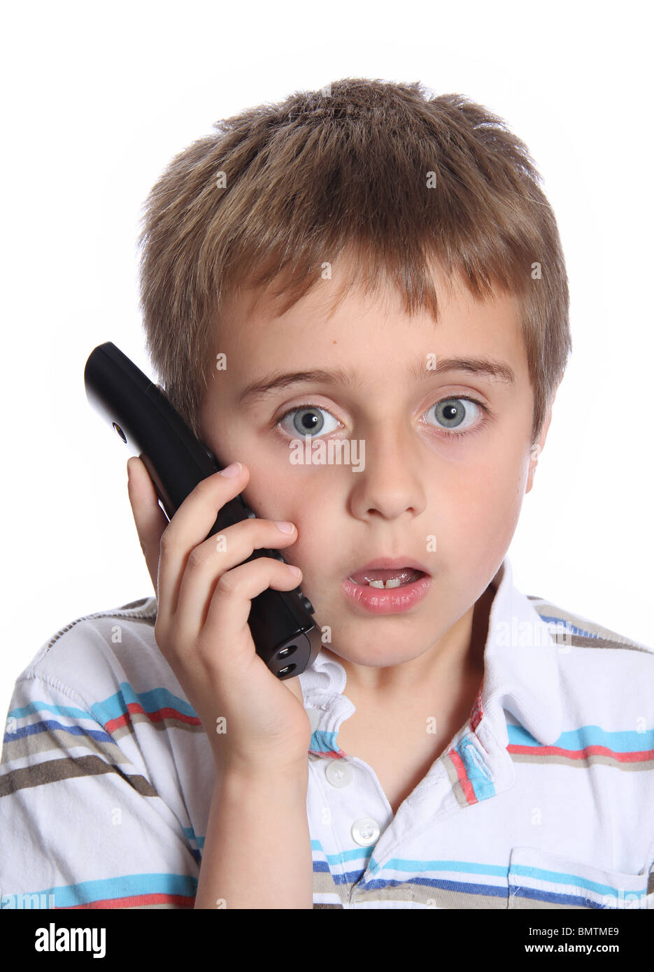 Small boy using a telephone talking to his friend Stock Photo - Alamy