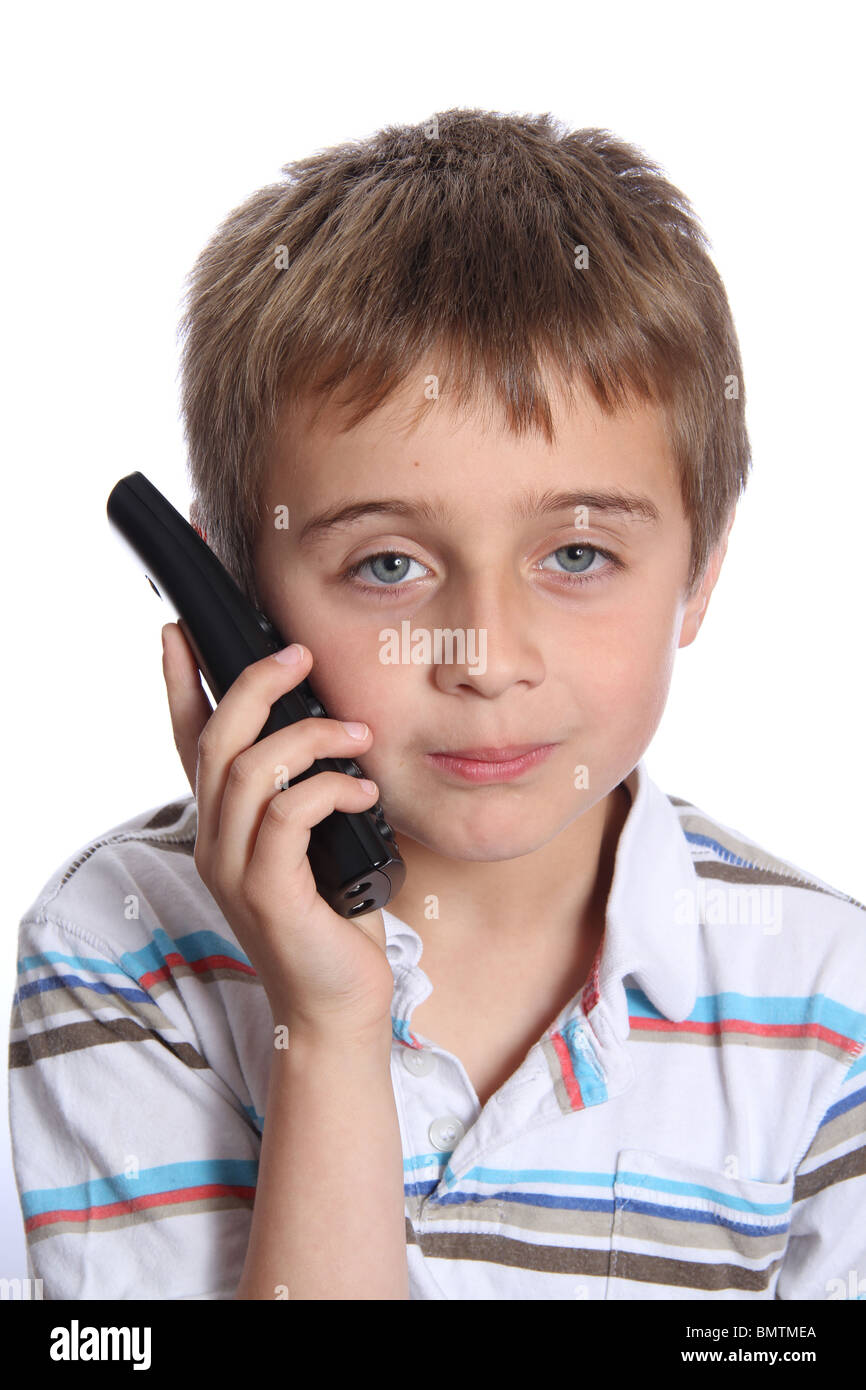 Small boy using a telephone talking to his friend Stock Photo - Alamy