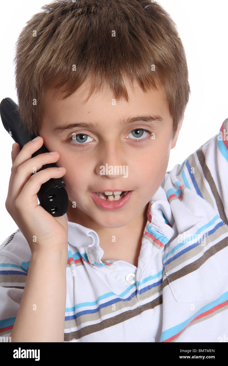 Small boy using a telephone on the telephone and looking happy Stock ...