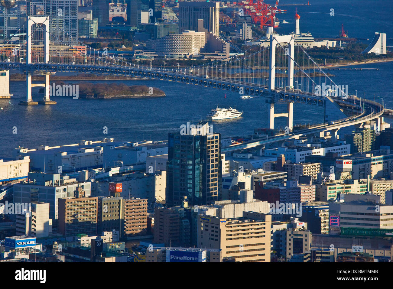 A sparkling white cruise ship passes under Rainbow Bridge, that ...