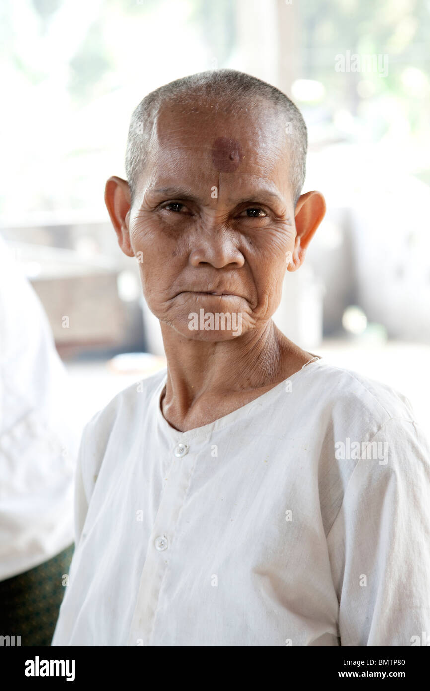 Portrait of elderly female monk in the Banteay Srei Pagoda Angkor Wat ...